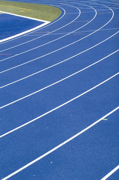 Blue running track Stock Photo by ©ArturVerkhovetskiy 150617388