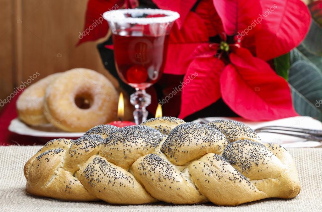 Festive bread on the table. Red christmas decorations in the bac Stock ...