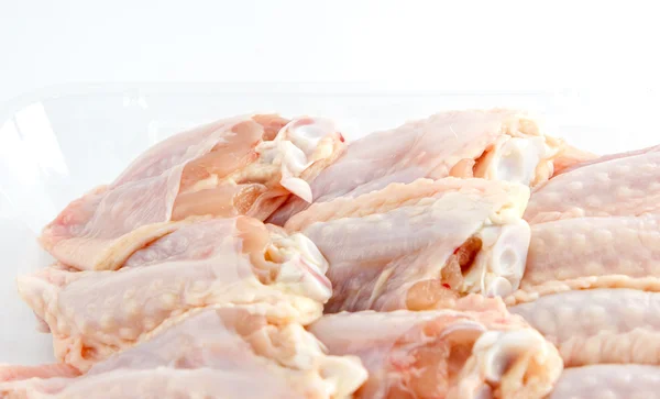 Fresh Chicken middle wings in package isolate — Stock Photo © Bunwit ...