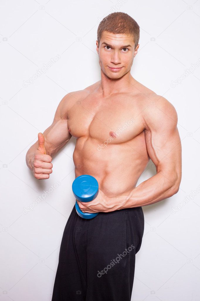 Bodybuilder with dumbbell showing thumb up Stock Photo by ©jakubzak92 ...