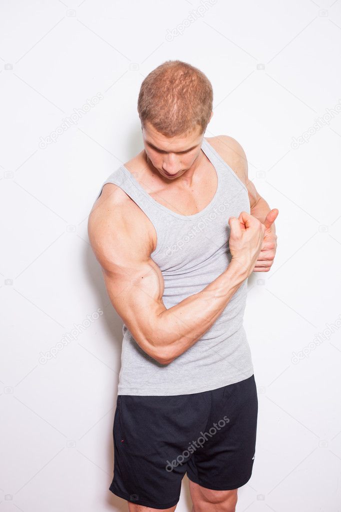 Bodybuilder showing his muscles Stock Photo by ©jakubzak92 44740491