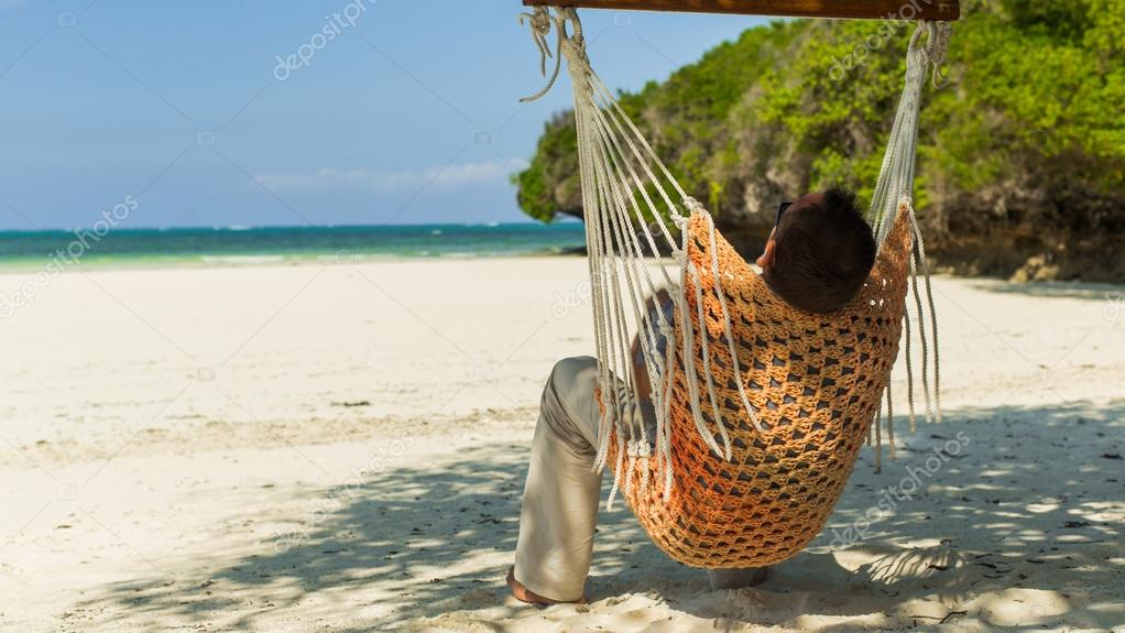 Man lying on hammock Stock Photo by ©jakubzak92 45089173