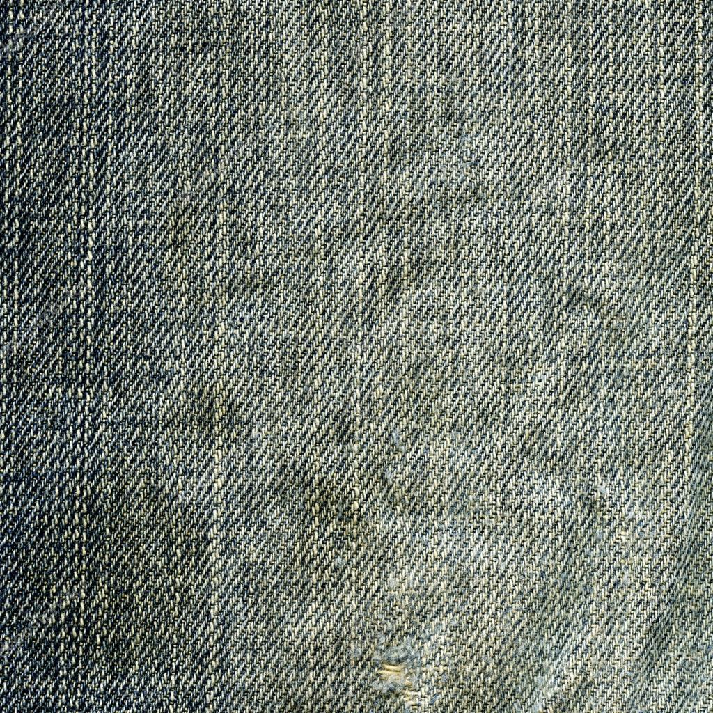 Denim Fabric Texture - Worn Out — Stock Photo © eldadcarin #22538525