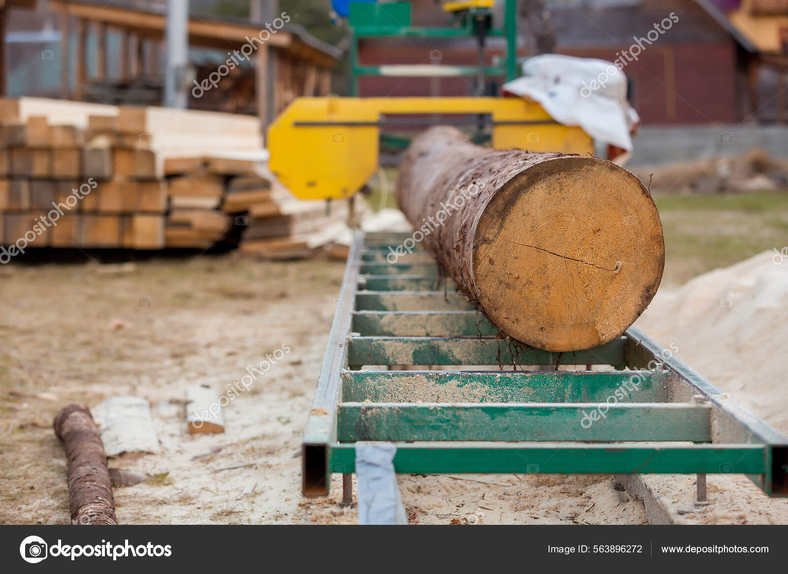 Sawmill. Process of machining logs in equipment sawmill. Machine saw ...