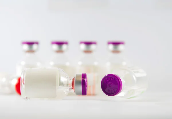 Purple cap injection vials show medicine concept - Stock Image - Everypixel