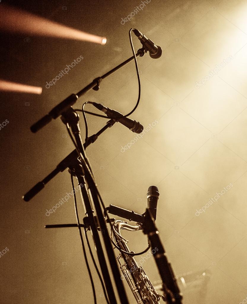 Set of microphones on stage with copyspace Stock Photo by ©aetb 34425561