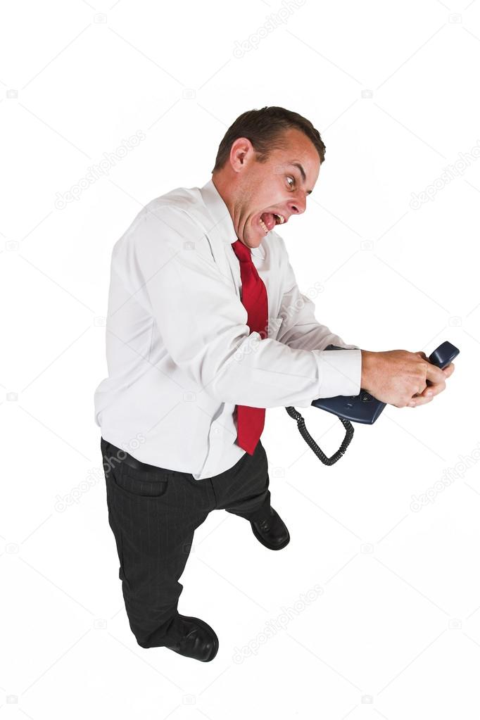 Businessman fighting with telephone. Stock Photo by ©Forgiss 22100565