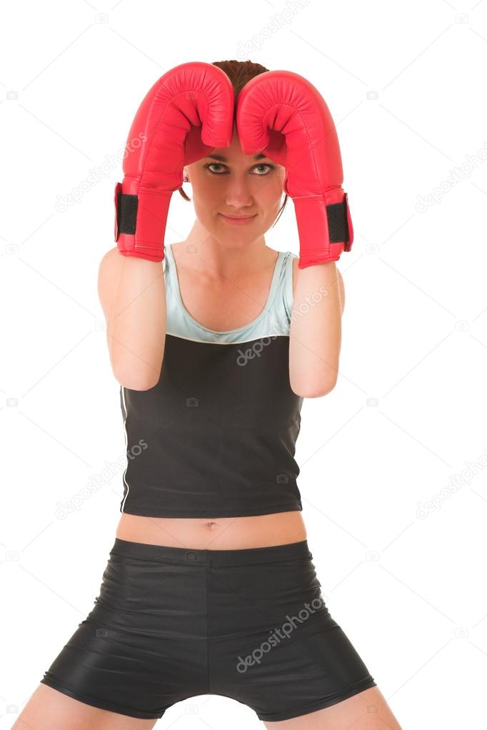 Sexy young adult Caucasian woman in a training wear with boxing gloves ...