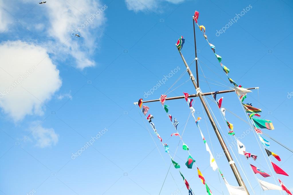 Various flags of various countries displayed together on a signal mast ...
