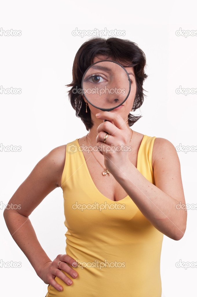 Mujer joven con lupa en el ojo — Foto de stock © axentevlad #24172269