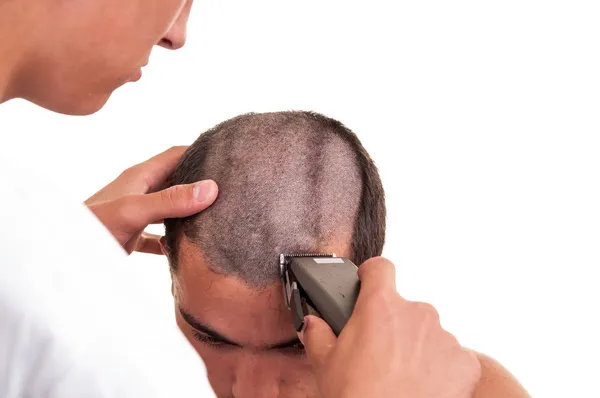 Barber cutting hair with clipper on white Stock Photo by ©axentevlad ...