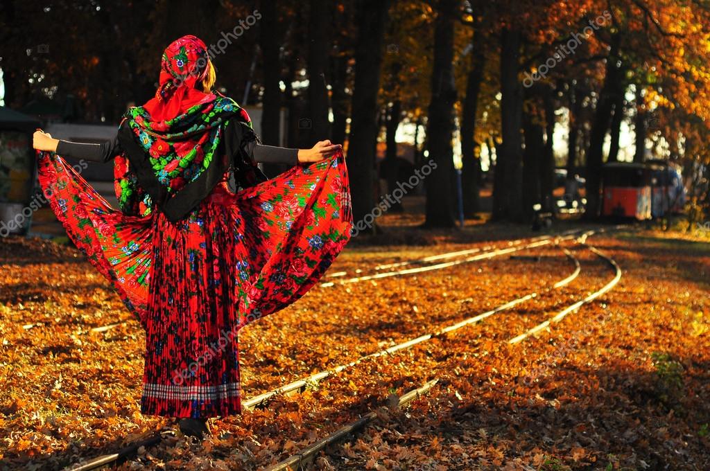 Romantic young gypsy woman pulls up dress and walks on the railr Stock ...