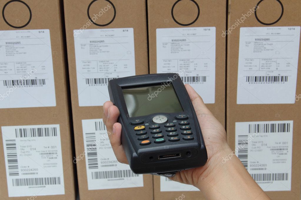 Scanning boxes with barcode scanner Stock Photo by ©mrkob 37745361