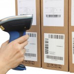 Scanning boxes with buletooth barcode scanner Stock Photo by ©mrkob ...