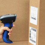 Scanning boxes with buletooth barcode scanner Stock Photo by ©mrkob ...