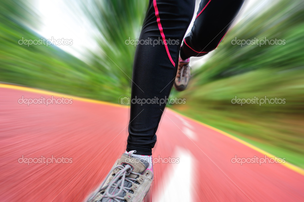 Woman runner athlete legs running on road Stock Photo by ©lzf 46215675