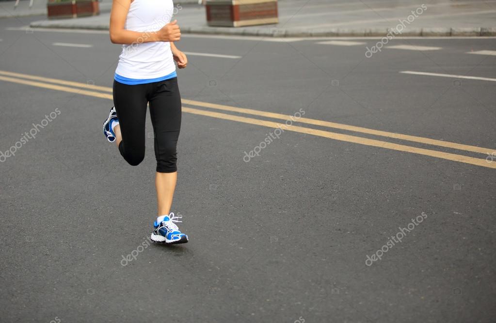 Runner athlete running on city street. Stock Photo by ©lzf 51313003