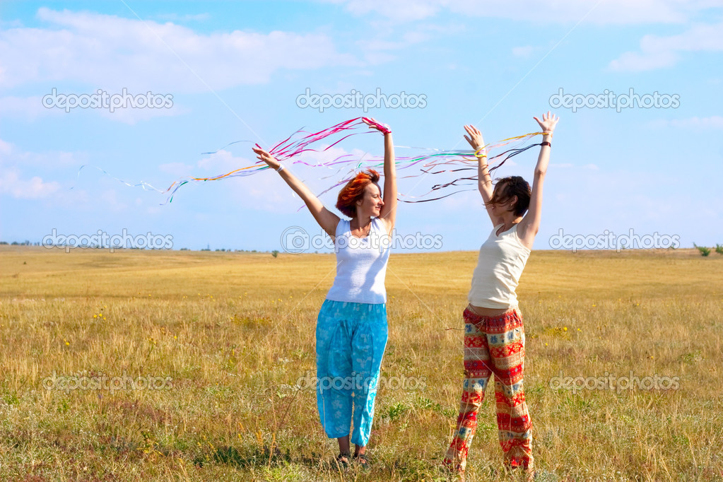 Two young woman with ribbons — Stock Photo © lesyanovo #27915501
