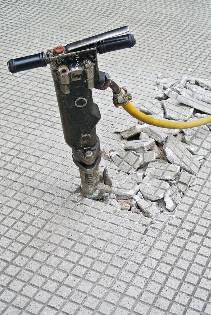 Pneumatic drill at work Stock Photo by ©Curvabezier 29404787