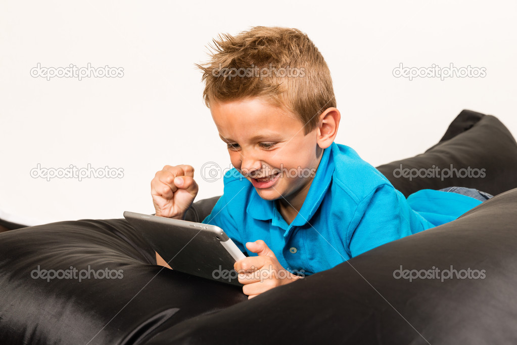 Boy with tablet and raised hand — Stock Photo © Bigandt #48073883