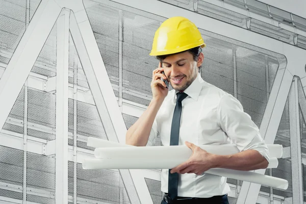 Engineer with blue prints and cell phone - Stock Image - Everypixel