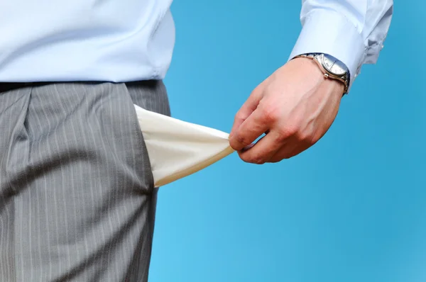 Man pulling out empty pocket — Stock Photo © Vitaly.R #59811557