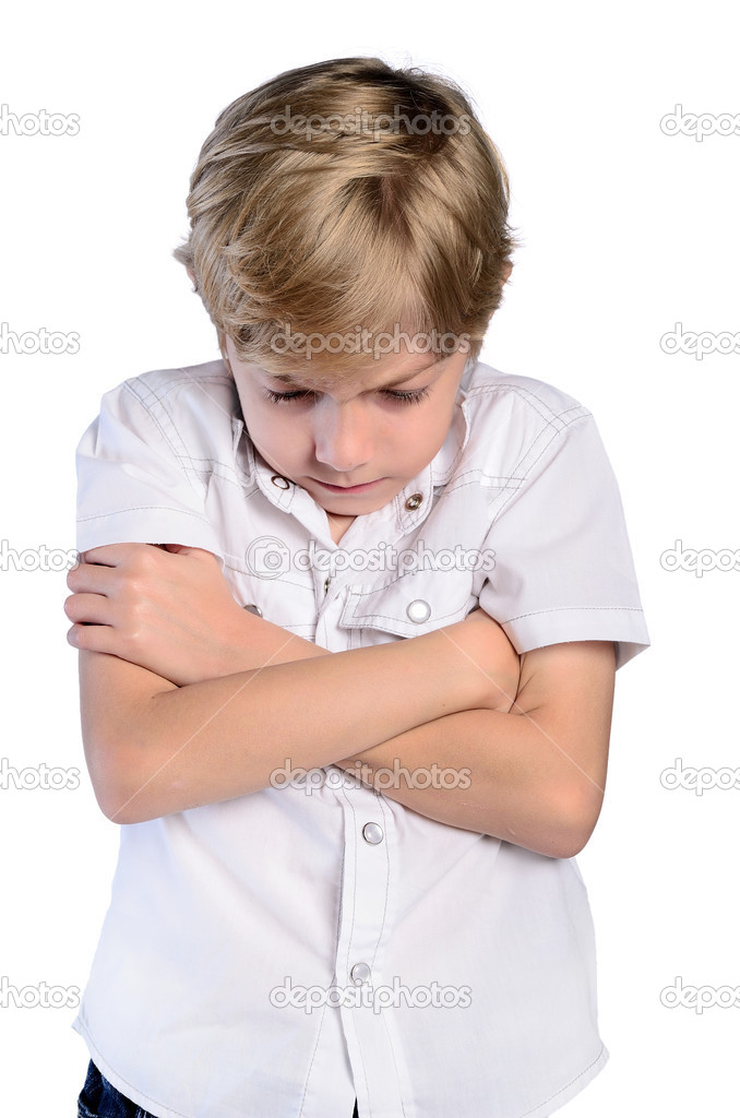 Upset young boy with crossed arms Stock Photo by ©Alex_F 50530711