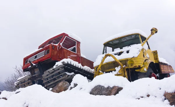 two vintage snow-cats covered with snow - Stock Image - Everypixel