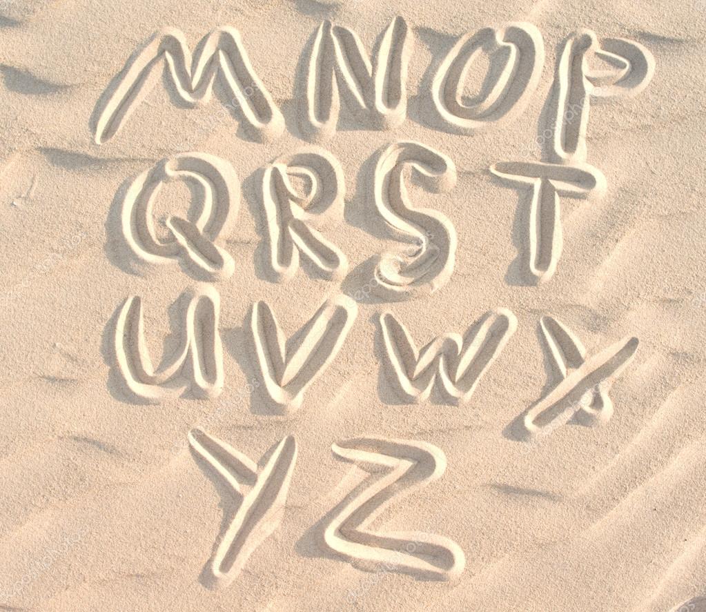 English alphabet letters on sand — Stock Photo © asafeliason #33996217