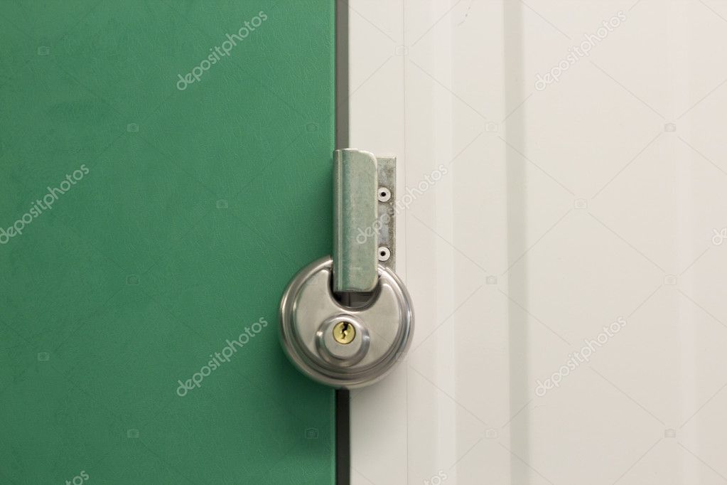 Round heavy duty pad lock on self storage unit Stock Photo by ©JSantti ...