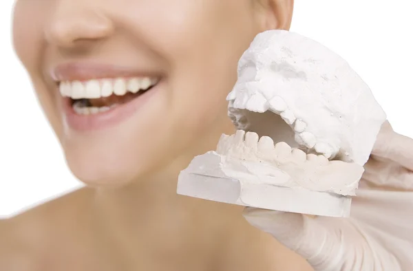 Woman holding a teeth sample Stock Photo by ©Kalcutta 48268271