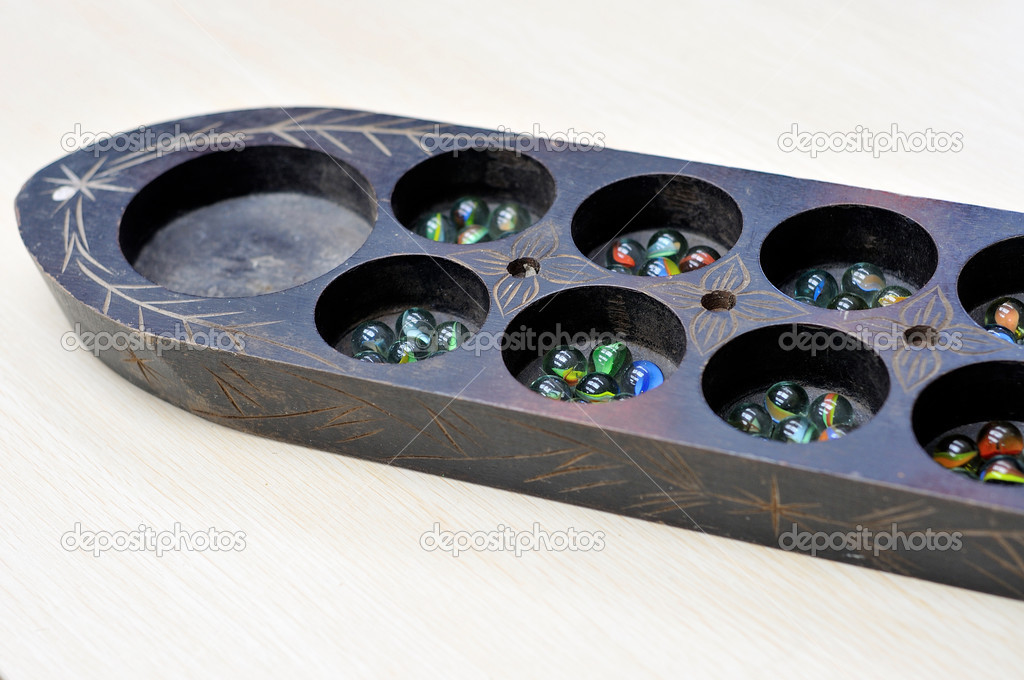Congkak board, Malay tradiotional game — Stock Photo © namzahs #38276457