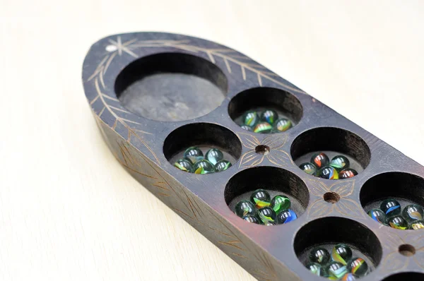 Wooden Congkak (Malaysian traditional game) Stock Photo by ©namzahs ...