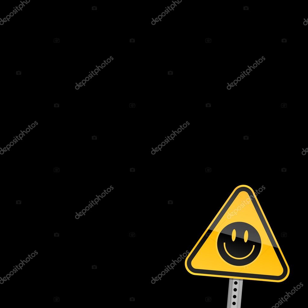Small yellow road warning sign with black smiley symbol on black ...