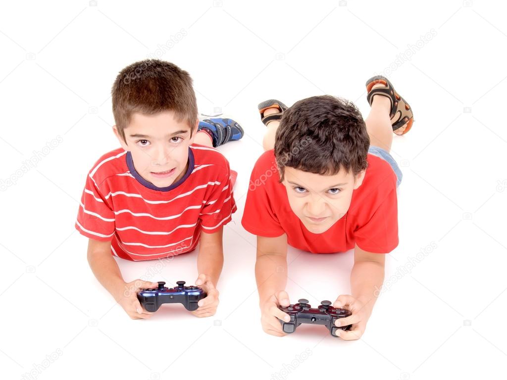Boys playing video games — Stock Photo © verkoka #49960395