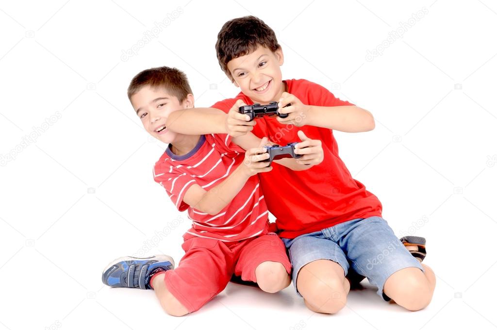 Boys playing video games — Stock Photo © verkoka #49960479