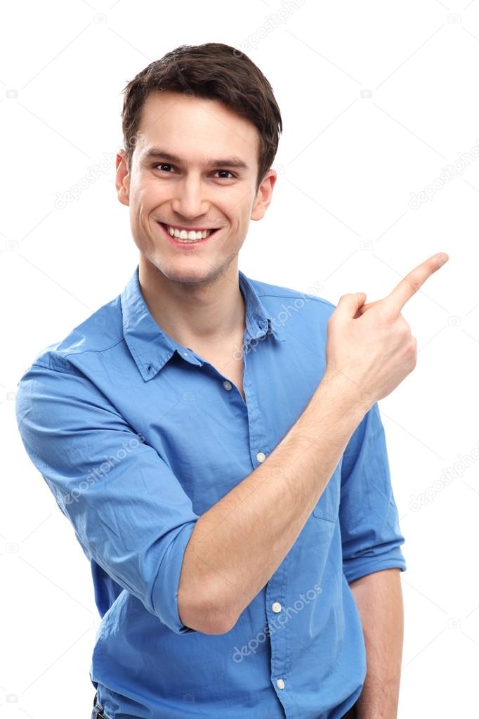 Young guy pointing — Stock Photo © pikselstock #23702887 Young guy pointing — Stock Photo © pikselstock #23702887