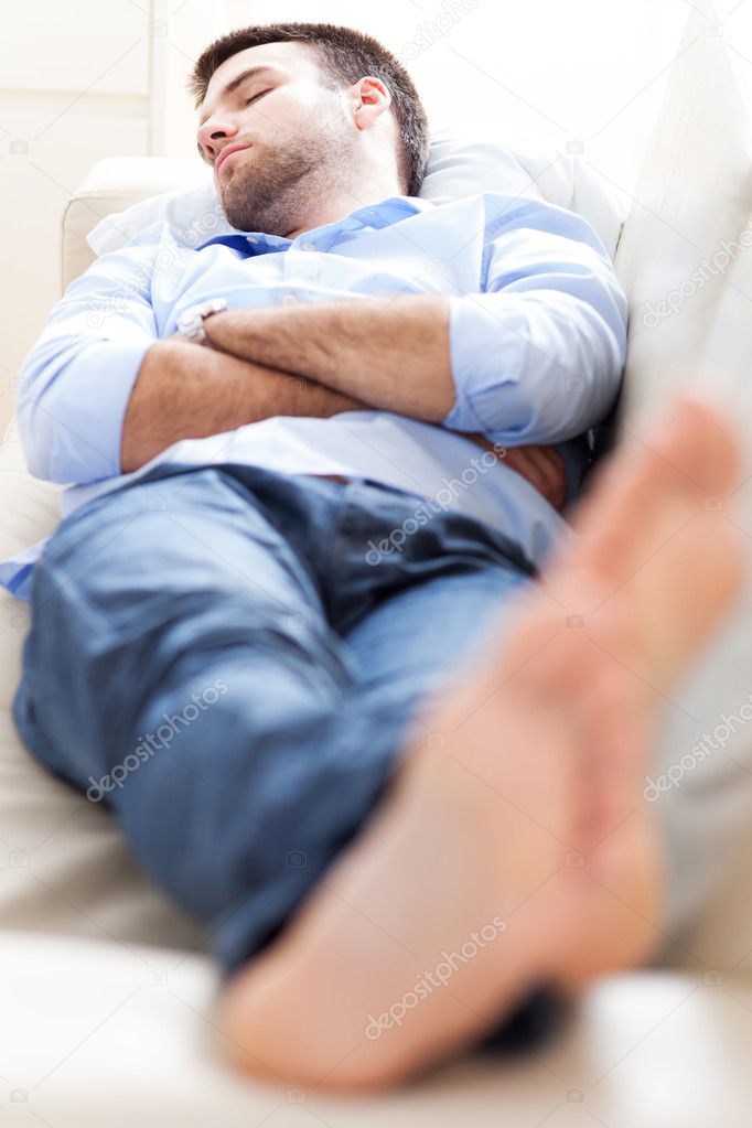 Man sleeping on sofa — Stock Photo © pikselstock #25794657