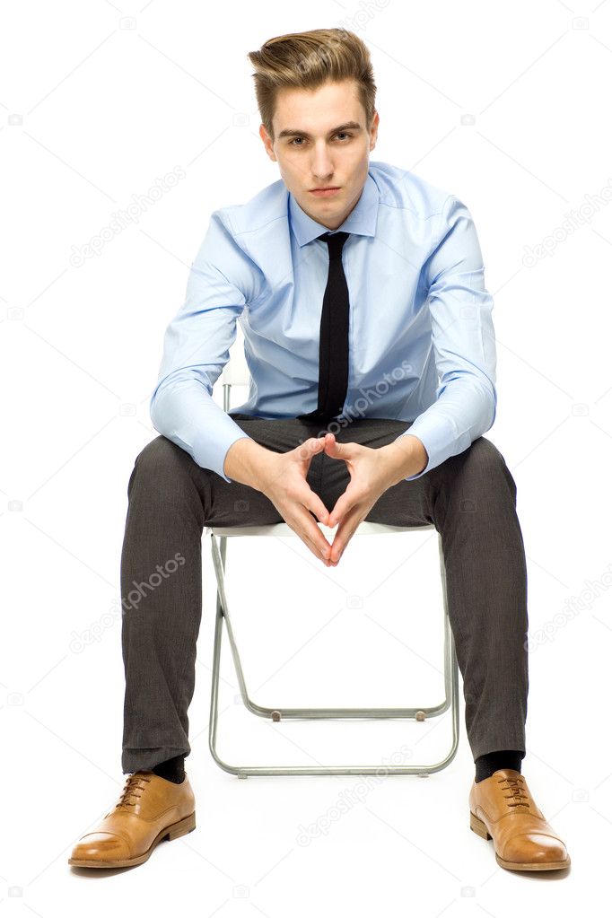 Handsome young man sitting Stock Photo by ©pikselstock 27345307