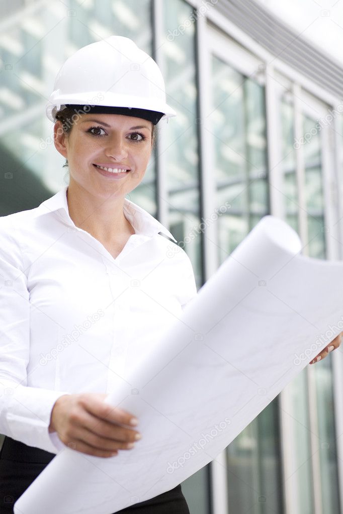 Female architect holding blueprints Stock Photo by ©pikselstock 28266265 Female architect holding blueprints Stock Photo by ©pikselstock 28266265