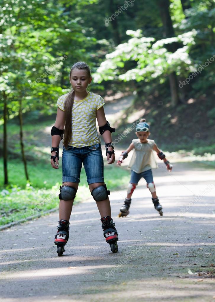 Kids rollerblading — Stock Photo © waldru #42433551