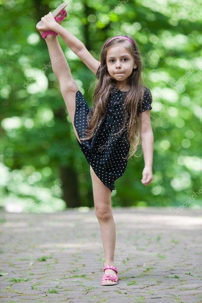 Little girl with great stretching — Stock Photo © waldru #47042703