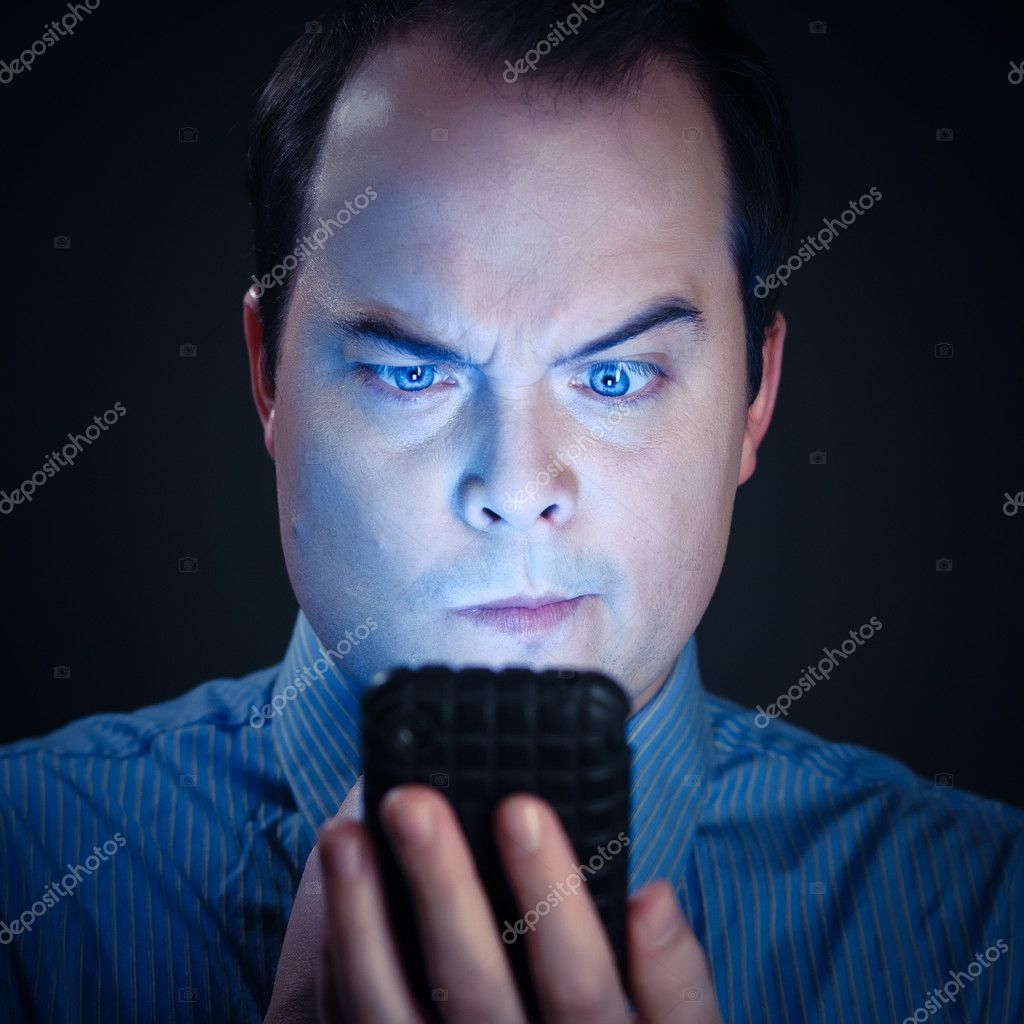 Man Quizzically Watching Something On Smart phone — Stock Photo ...