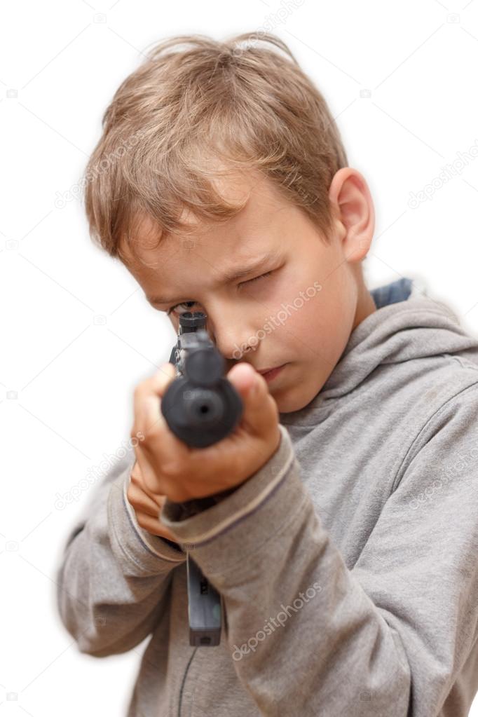 Boy plays with gun. — Stock Photo © seniorcarlo #30760693