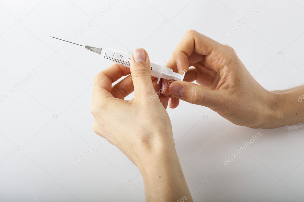 Hands with syringe Stock Photo by ©photographee.eu 29349359