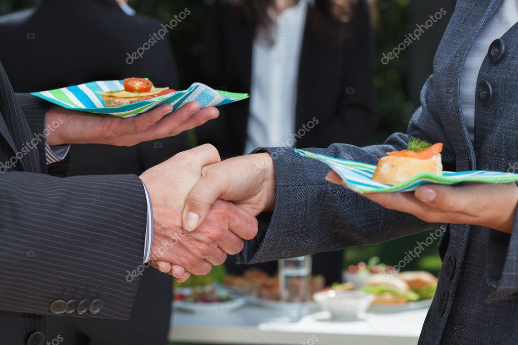 Business handshake during lunch Stock Photo by ©photographee.eu 35557287
