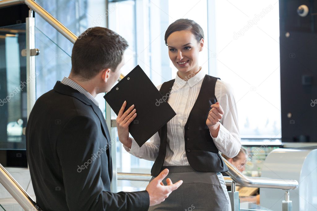 Two office workers talking Stock Photo by ©photographee.eu 44310255