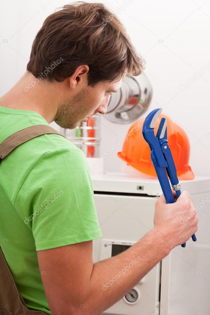 Broken central heating boiler Stock Photo by ©photographee.eu 45931335