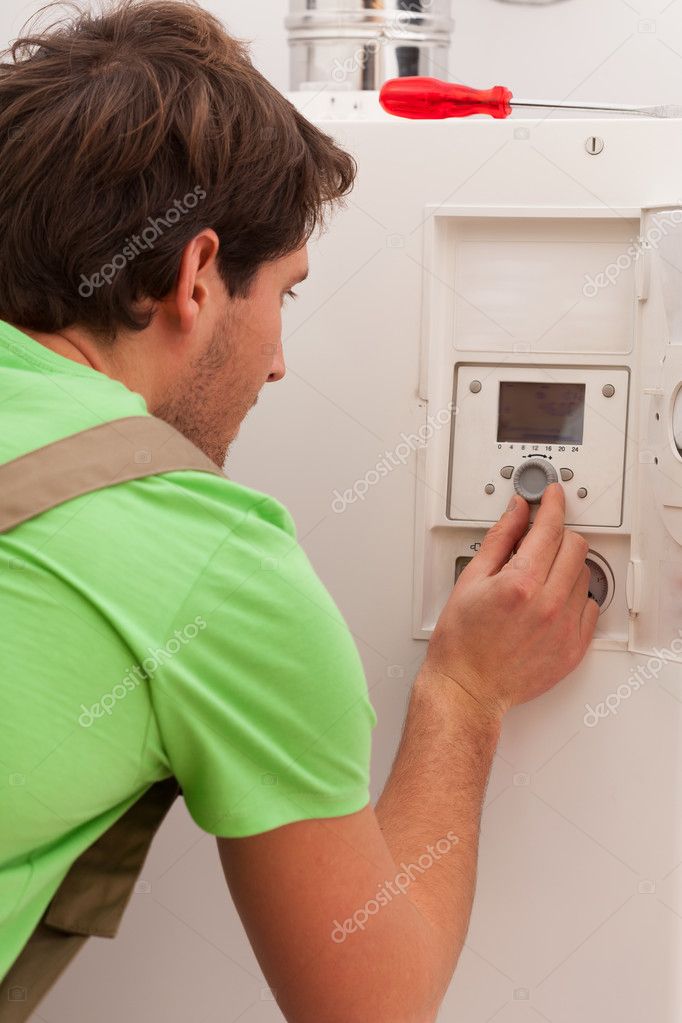 Man changing temperature setting — Stock Photo © photographee.eu #45931443