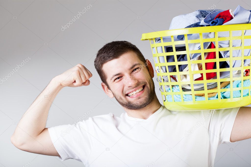 Happy man doingg laundry — Stock Photo © photographee.eu #48140397